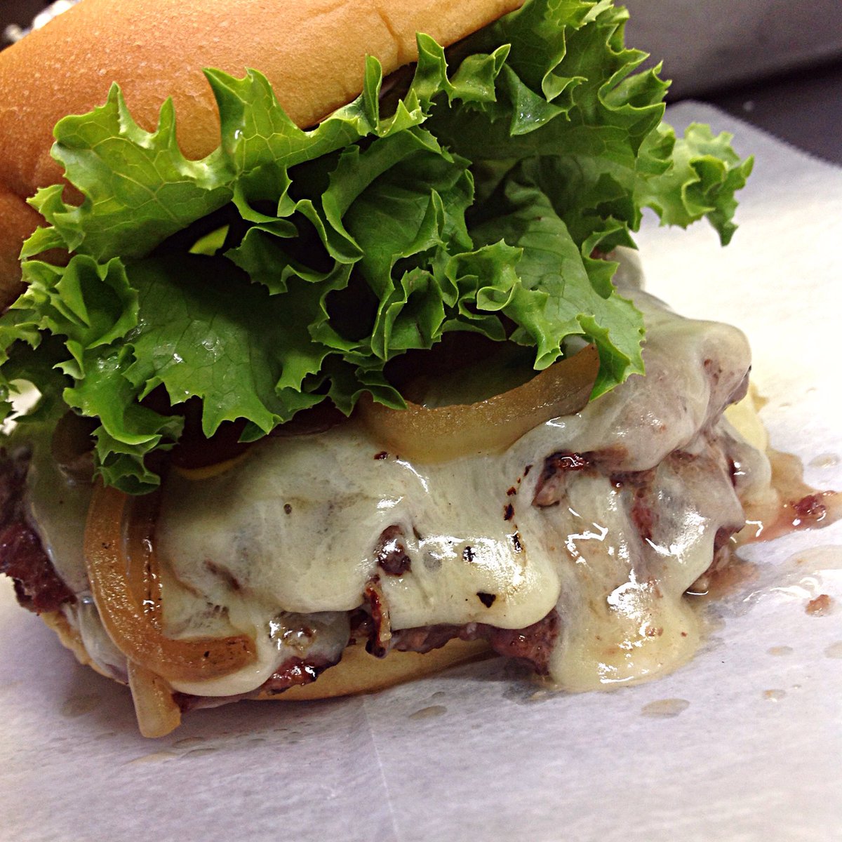 Two Niman Ranch natural angus beef patties with Gruyere cheese, grilled ...